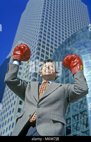 OFFICE WORKER WEARS BOXING GLOVES Stock Photo - Alamy
