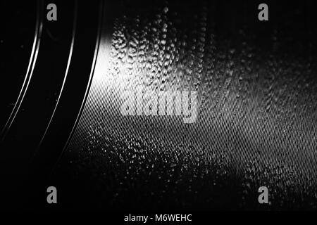 Extreme close up of vinyl record black surface, grooves texture and ...