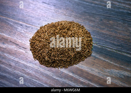 Various forms of carum carvi on a wooden background Stock Photo - Alamy