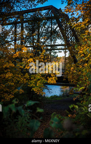 OLD RAILROAD BRIDGE IN WEST JAVA Motorcyclists cross the Cirahong ...
