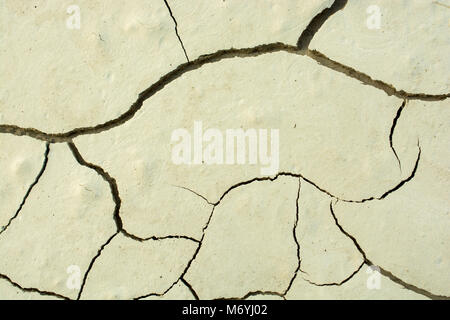 Grey color dry cracked muddy earth as a background texture Stock Photo ...