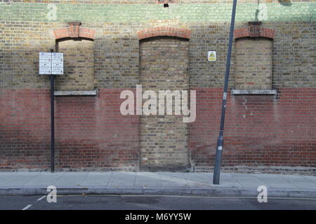 Bricked up windows and door of an old warehouse Stock Photo - Alamy