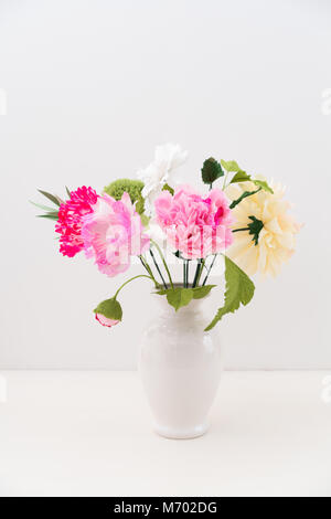 Vase of pastel pink carnation flowers on wooden table Stock Photo - Alamy