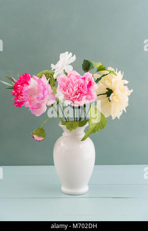 Vase of pastel pink carnation flowers on wooden table Stock Photo - Alamy