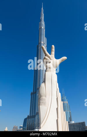 Three finger statue in Burj Khalifa Park in Dubai Stock Photo - Alamy