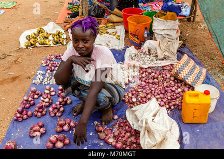 A Young Woman Sells Onions At The Alduba Tribal Market, near Keyafer ...
