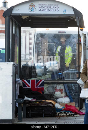 Windsor, UK. A Bus shelter is filled with possessions of homeless who ...