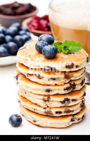 Stack of welsh cakes with blueberry and a cup of green tea Stock Photo ...