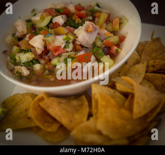 Conch Ceviche served with Tortilla chips Stock Photo - Alamy