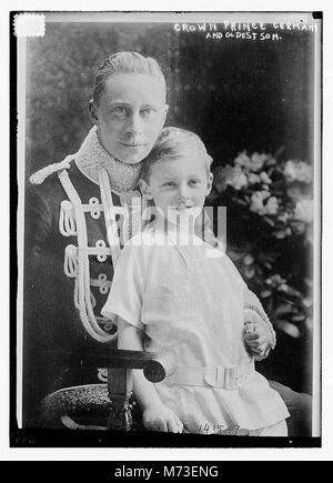 This photograph depicts the son of the Crown Prince of Germany holding ...