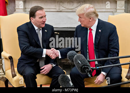President Donald Trump, right, shakes the hand of Nassau County ...