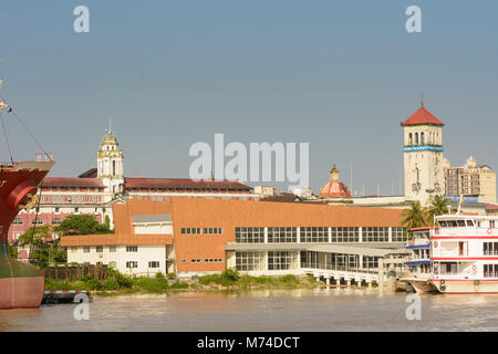 A ship and the Myanmar Port Authority building by the Yangon river in ...