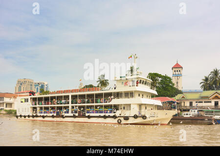 A ship and the Myanmar Port Authority building by the Yangon river in ...