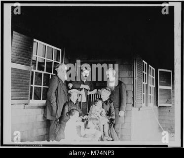 A photograph of Alexander Graham Bell and his family, with a nurse ...