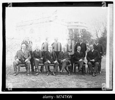 A photograph of President Warren G. Harding standing on the White House ...