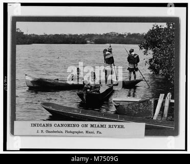 Native American Indians canoeing in a Traditional Dugout Canoe at the ...