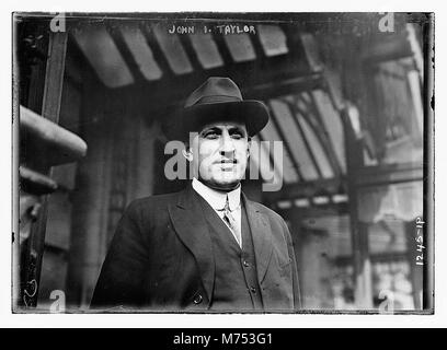 Boston Red Sox owner John Henry, left, gestures before a baseball game ...