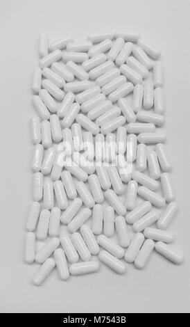 White capsules in the pharmacy laboratory Stock Photo - Alamy
