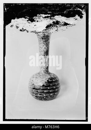 A photograph of antique glass, showcasing its intricate design and ...