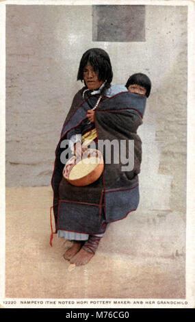 Nampeyo, a renowned Hopi pottery maker, sits surrounded by her ...