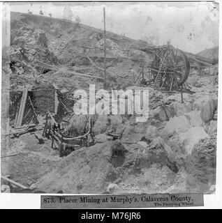 A photograph of placer mining, showcasing the process of panning for ...