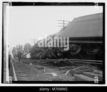 This photograph captures the aftermath of a train wreck in Harrison ...