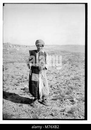 A shepherd playing a flute, possibly in a rural setting. The image ...