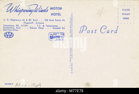A photograph of the Whispering Winds Motor Hotel, captured by Douglas ...