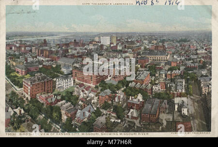 A bird's eye view of a river crossing the city of Alcacer do Sal in ...
