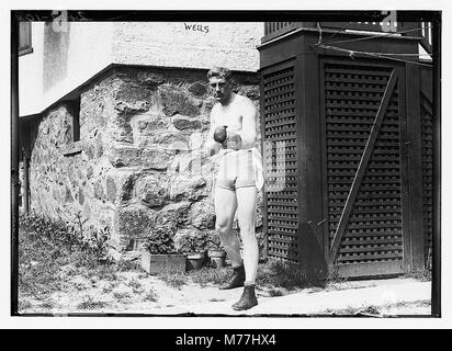 This image shows English boxer Billy Wells preparing for his fight with ...