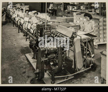 The image shows the process of book manufacturing, specifically ...