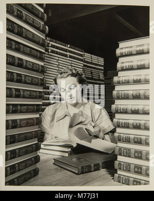 An image depicting the process of book manufacturing, specifically ...