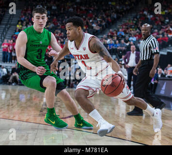 Utah guard Justin Bibbins (1) drives around Stanford guard Robert ...
