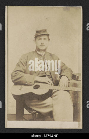 An unidentified Union soldier is shown in a typical Civil War uniform ...