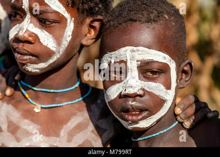 Two black children of the Hamar / Hamer tribe in traditional dress in ...