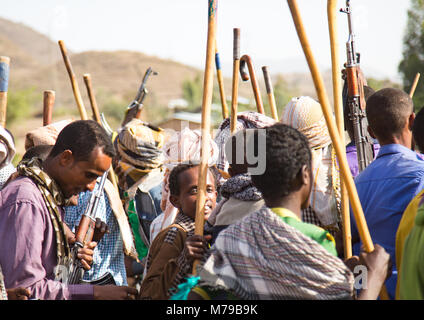 Oromo men and boys with sticks, Canes and weapons dancing and ...