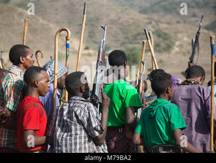 Oromo men and boys with sticks, Canes and weapons dancing and ...