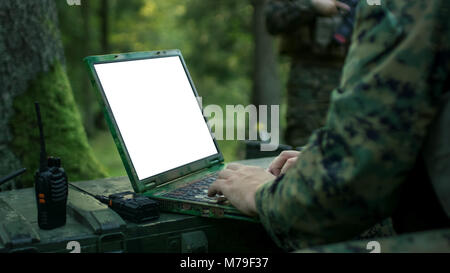 Close Up soldier with laptop with white background Stock Photo - Alamy
