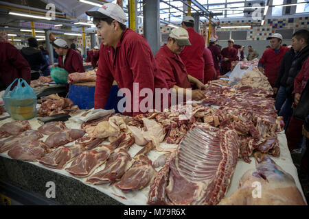 A butcher is traded in the meat range of Dorogomilovskiy market in ...