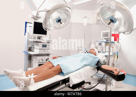 MAN LYING ON OPERATING TABLE Stock Photo - Alamy