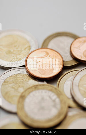 Close up shot of shiny coins separated in a special container Stock ...