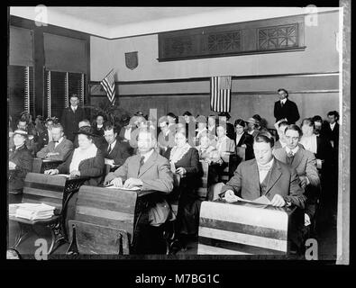 A photograph of a naturalization class at the Bureau of Labor, showing ...