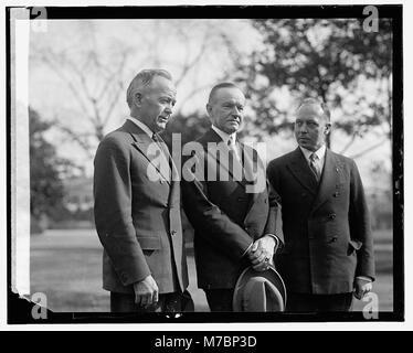This image shows President Calvin Coolidge greeting a group of children ...