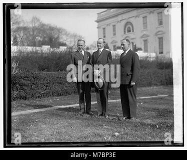 This photograph shows President Calvin Coolidge with his aides on June ...