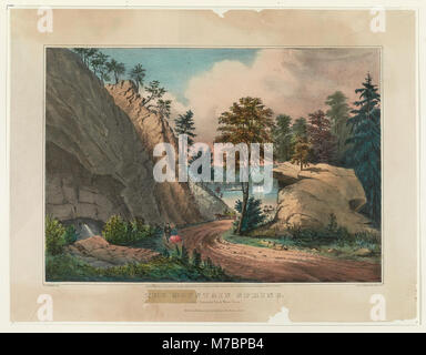 A serene landscape photograph captures a rocky coastline bathed in the ...