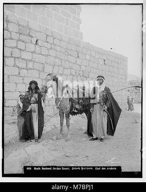 A village sheikh, depicted in this image, tells his beads, representing ...