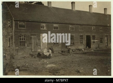 A photograph depicting a crowded tenement housing cranberry pickers ...