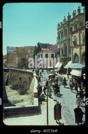 A photograph showing a scene inside Jaffa Gate, with city men wearing ...