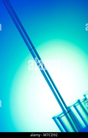 Dropper over test tube Stock Photo - Alamy