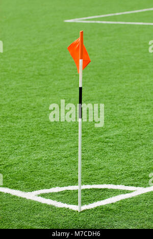 A red corner flag on a football field Stock Photo - Alamy